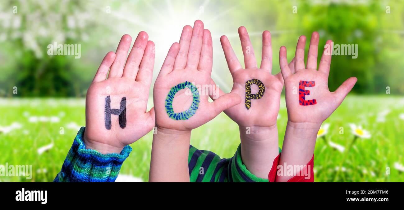 Children Hands Building Word Hope, Grass Meadow Stock Photo - Alamy