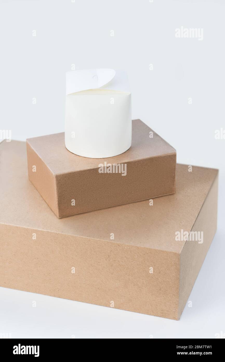 Close up picture of a few brown boxes and a white box Stock Photo - Alamy
