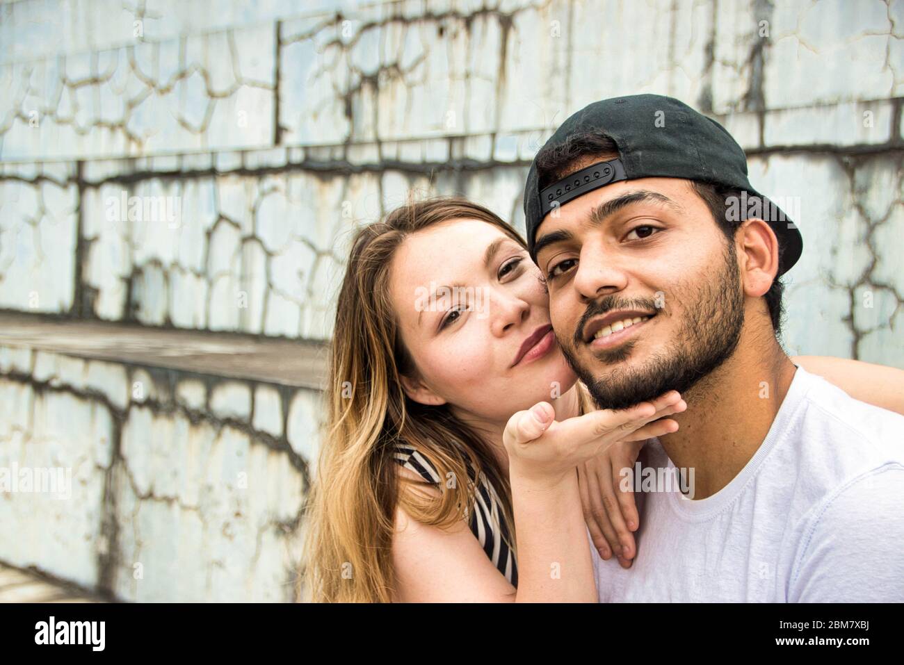 A Couple is Sitting closely and talking to each other Stock Photo - Alamy