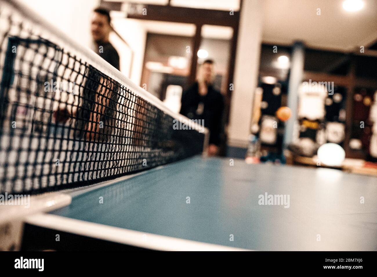 While colleagues playing table tennis hi-res stock photography and ...