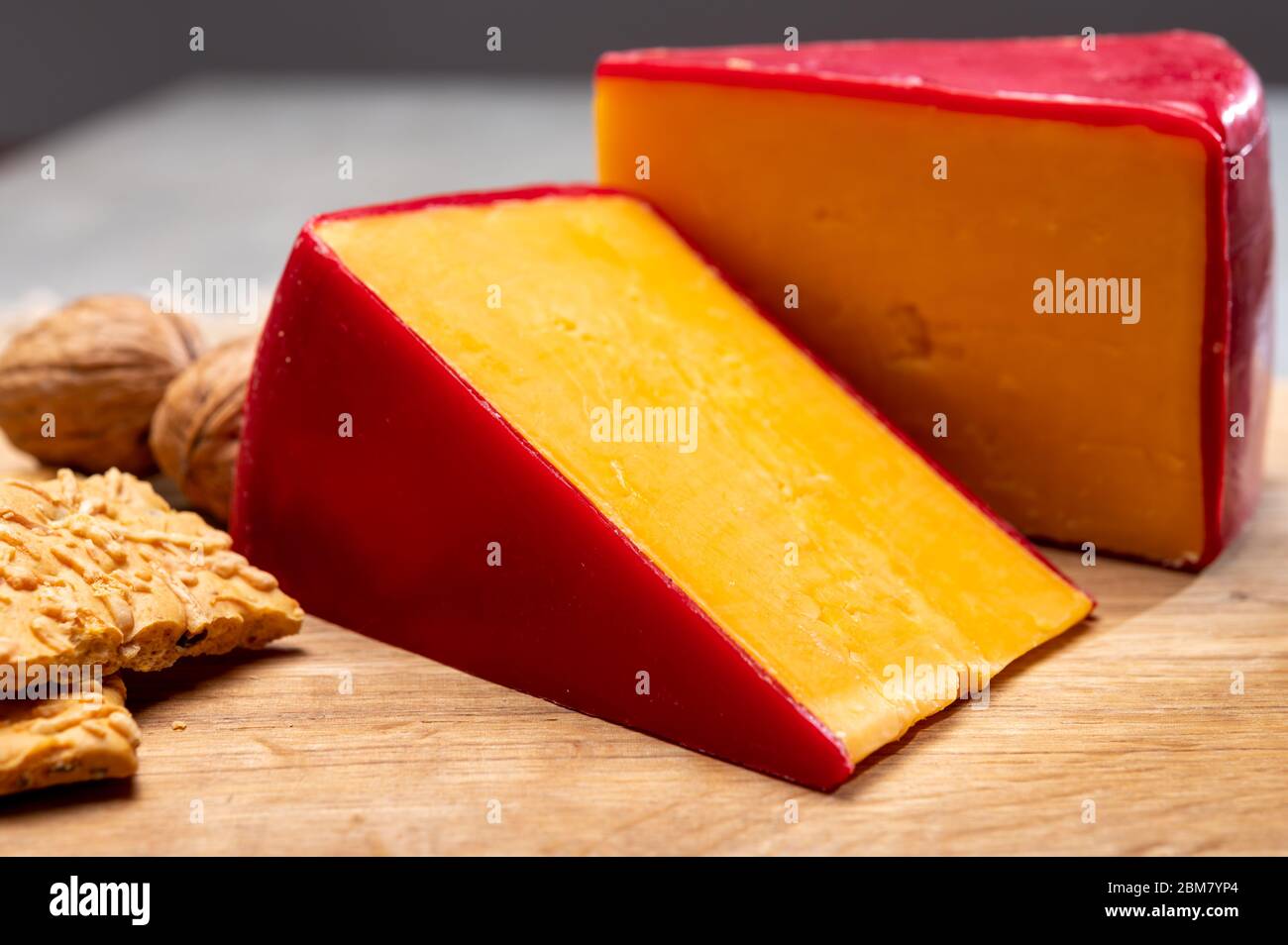 British red waxed yellow cheddar cheese and crackers with grated cheese ...