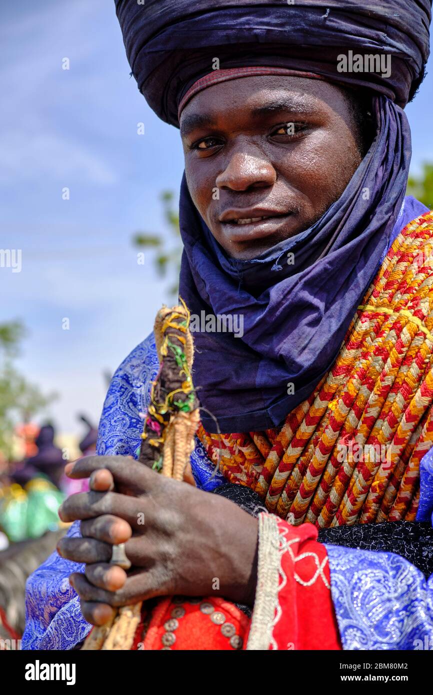 Nobleman rider dressed in a colourful outfit mounting an embellished ...