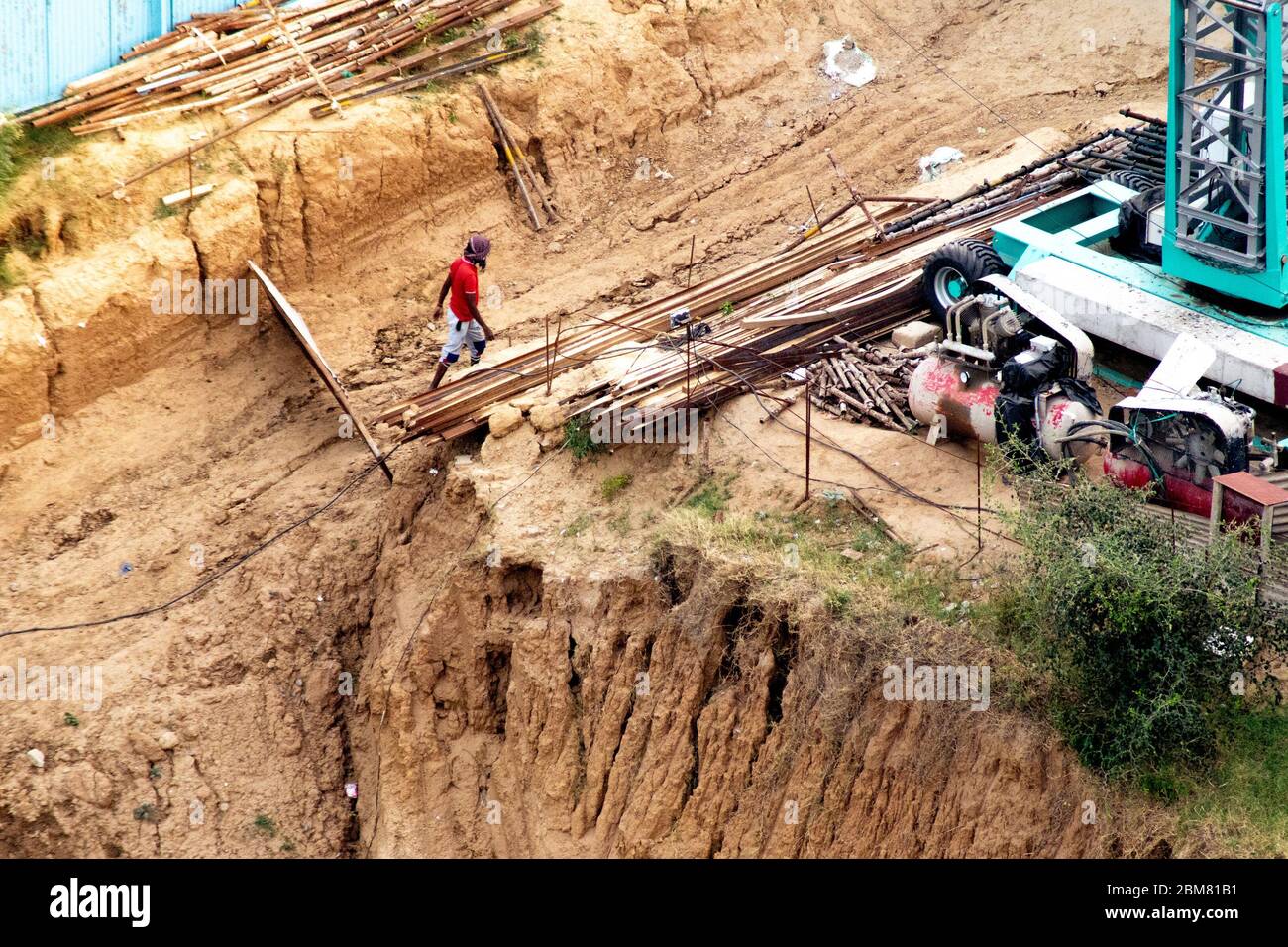 Construction worker barricading the ramp to a construction site due to ...