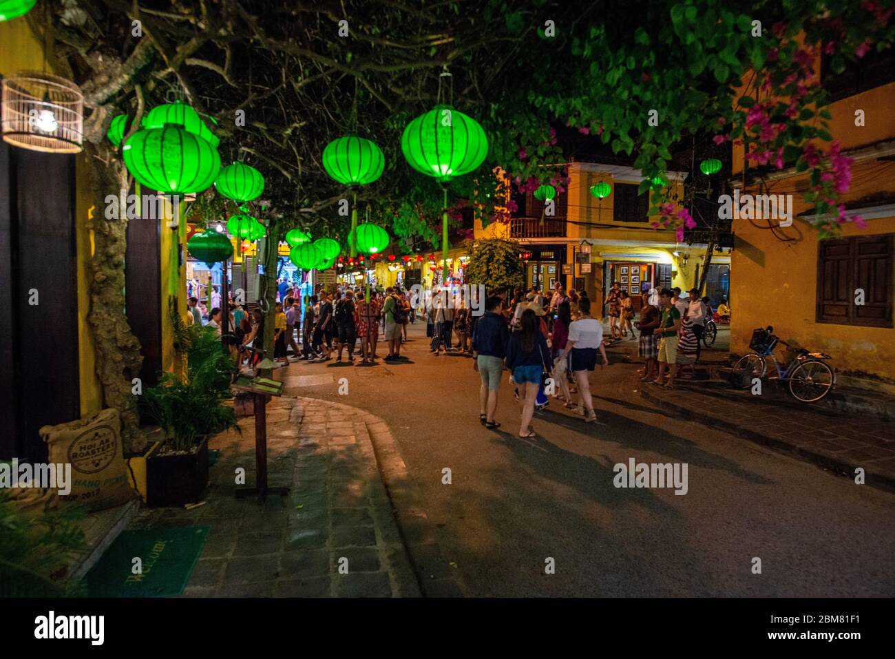 Hoi An, Vietnam - April 11, 2018: A street of Hoi An at night with some ...