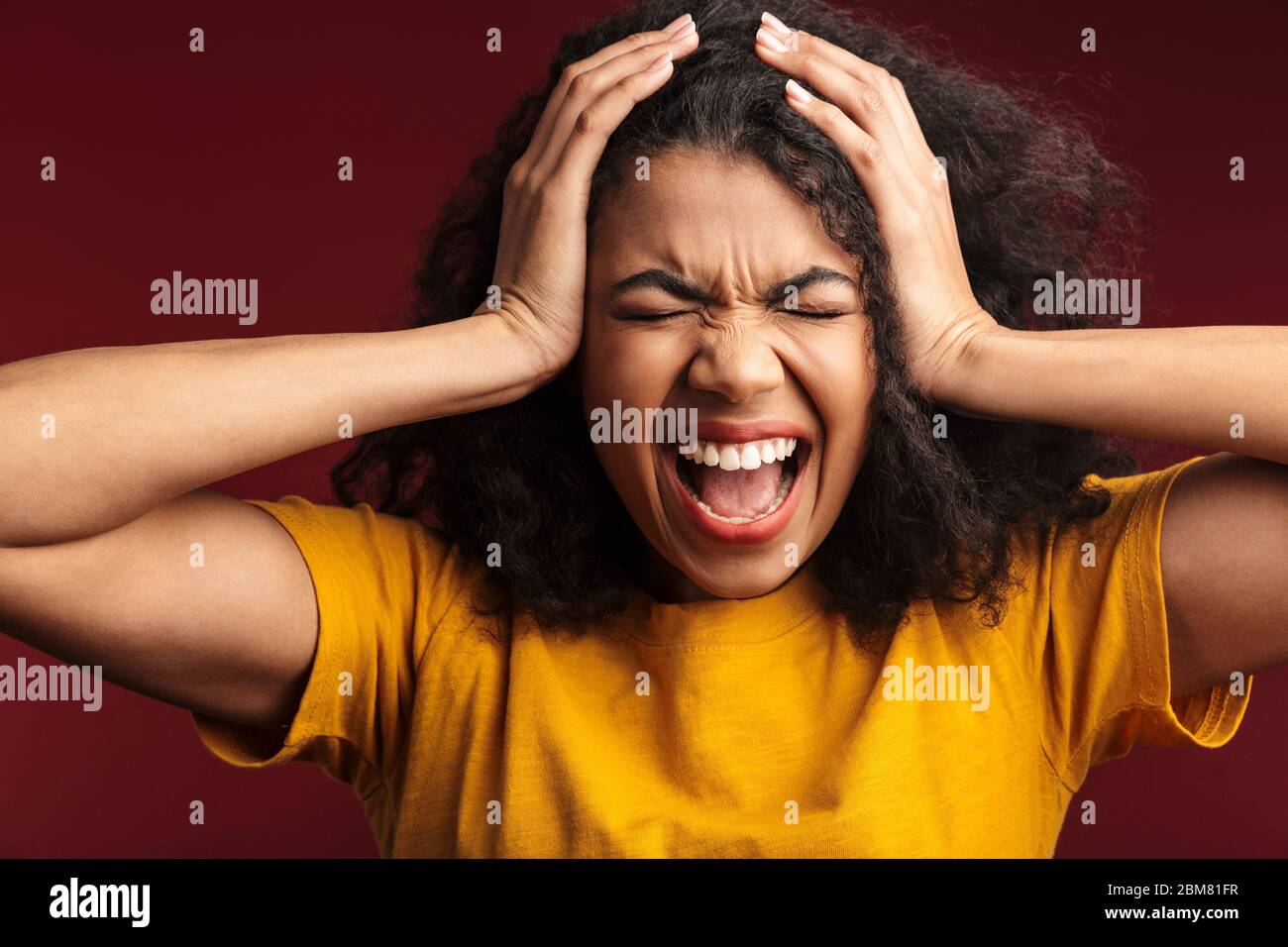 Image of stressed screaming young african woman posing isolated over ...