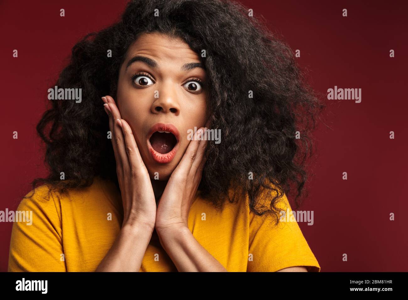 Image Of Shocked Brunette African American Woman With Curly Hair