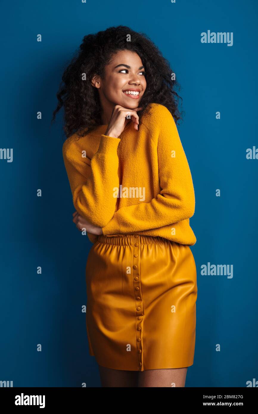 Image of a pretty happy positive optimistic young african woman posing ...