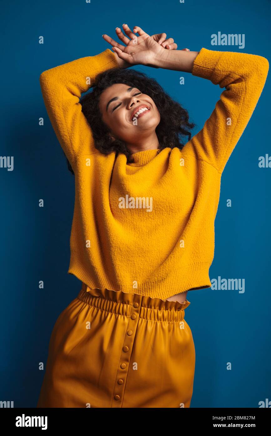 Image of a pretty happy positive optimistic young african woman posing ...