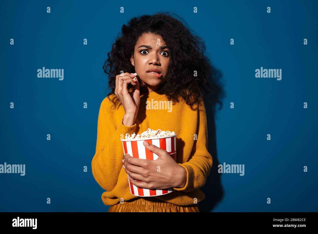 Woman standing tv wall hi-res stock photography and images - Alamy