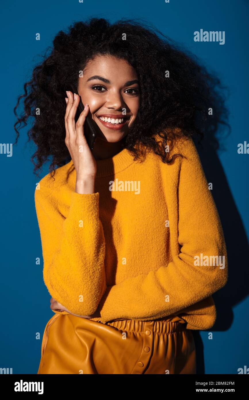 Image Of A Pretty Cheery Smiling African Woman Posing Isolated Over