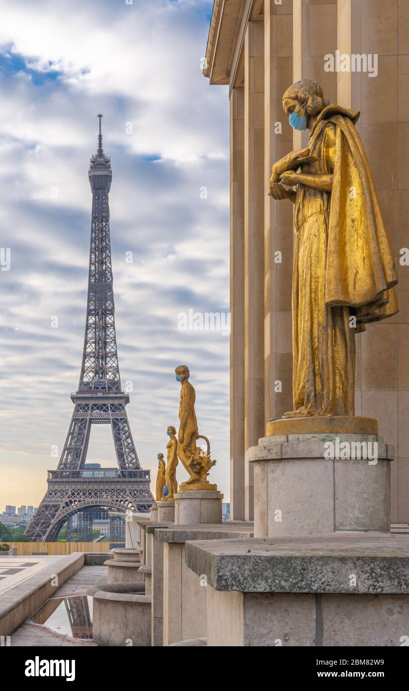 Paris, France - 05 06 2020: Golden statue of a woman wearing a surgical ...