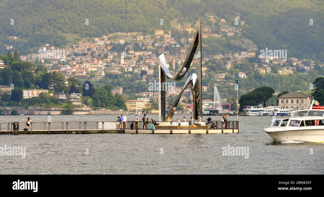 COMO, ITALY - JUNE 2019: Modern sculpture on a jetty which runs out ...