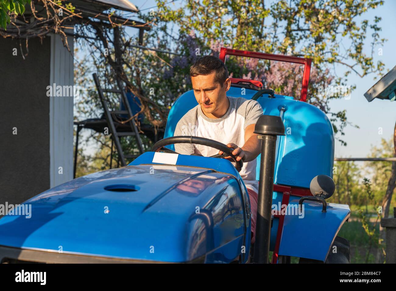 Man driving farm tractor profile hi-res stock photography and images ...