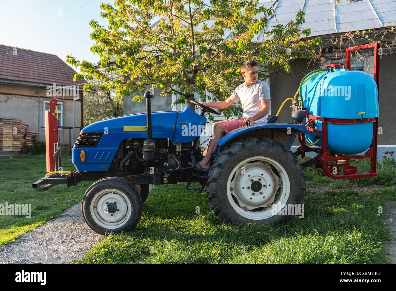 Man driving farm tractor profile hi-res stock photography and images ...
