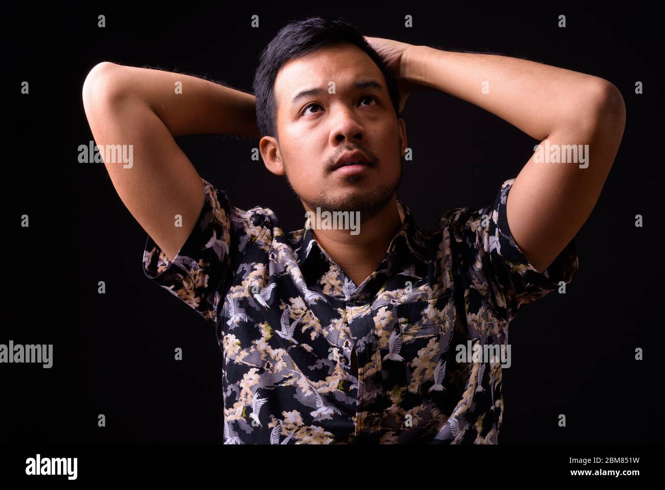 Asian guy hand behind head hi-res stock photography and images - Alamy