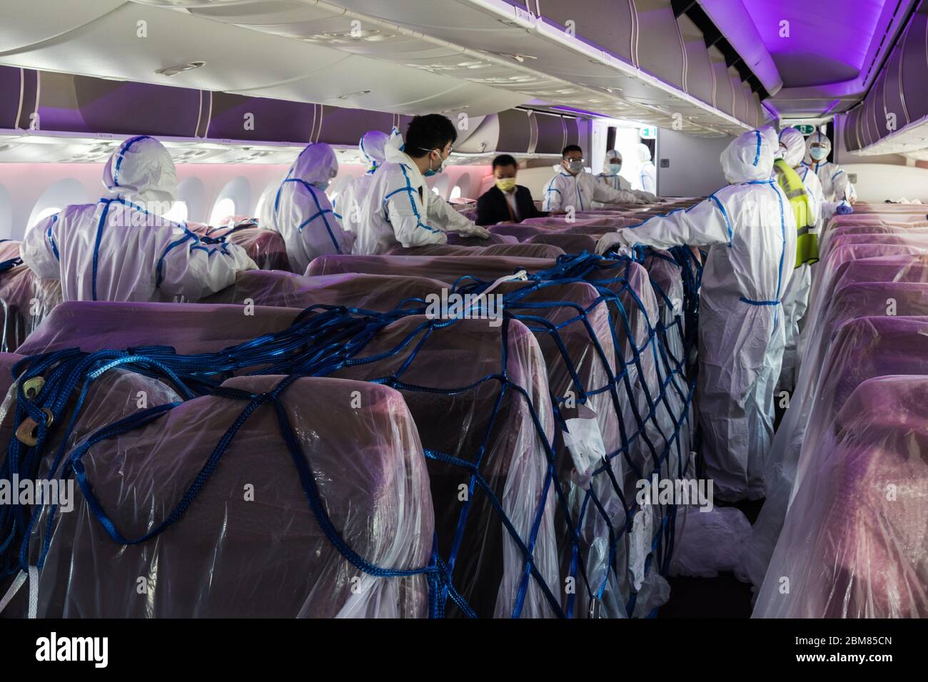 PPE being loaded in the passenger cabin of an airliner during the ...