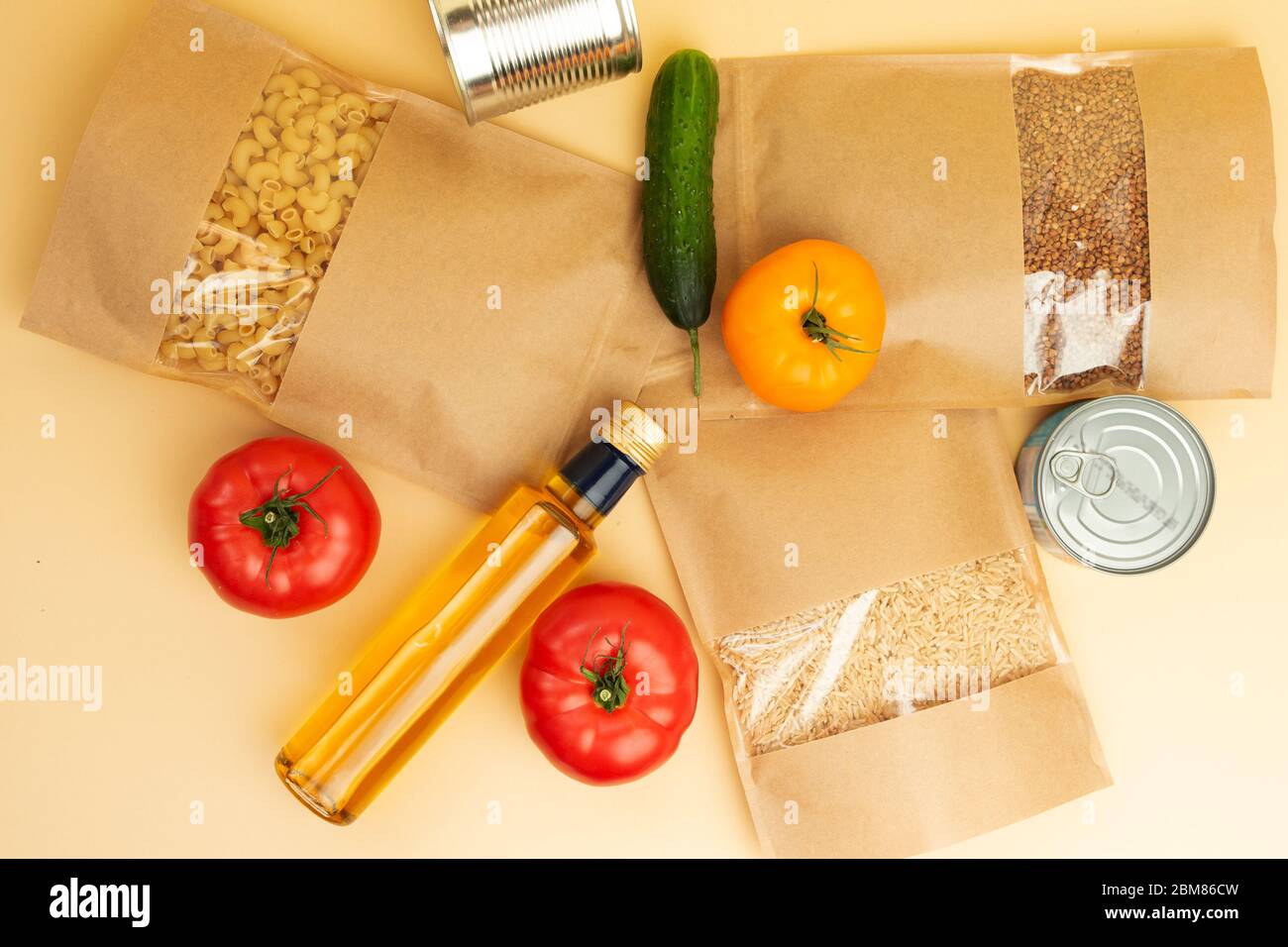 A set of necessary food supplies. Buckwheat, pasta, rice in a kraft ...