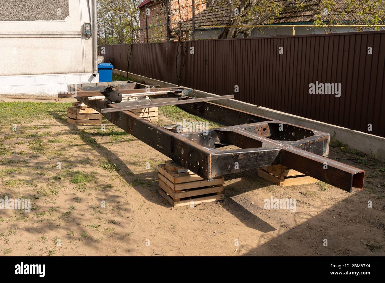 Metal construction stands on the wooden boxes in the backyard Stock ...
