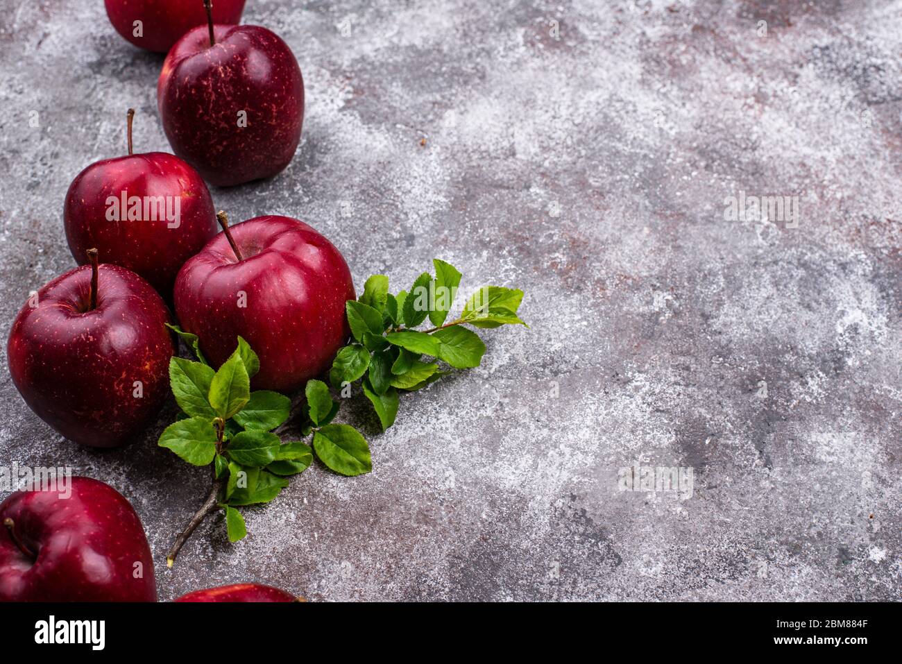 Fresh red ripe apples on gray background Stock Photo - Alamy