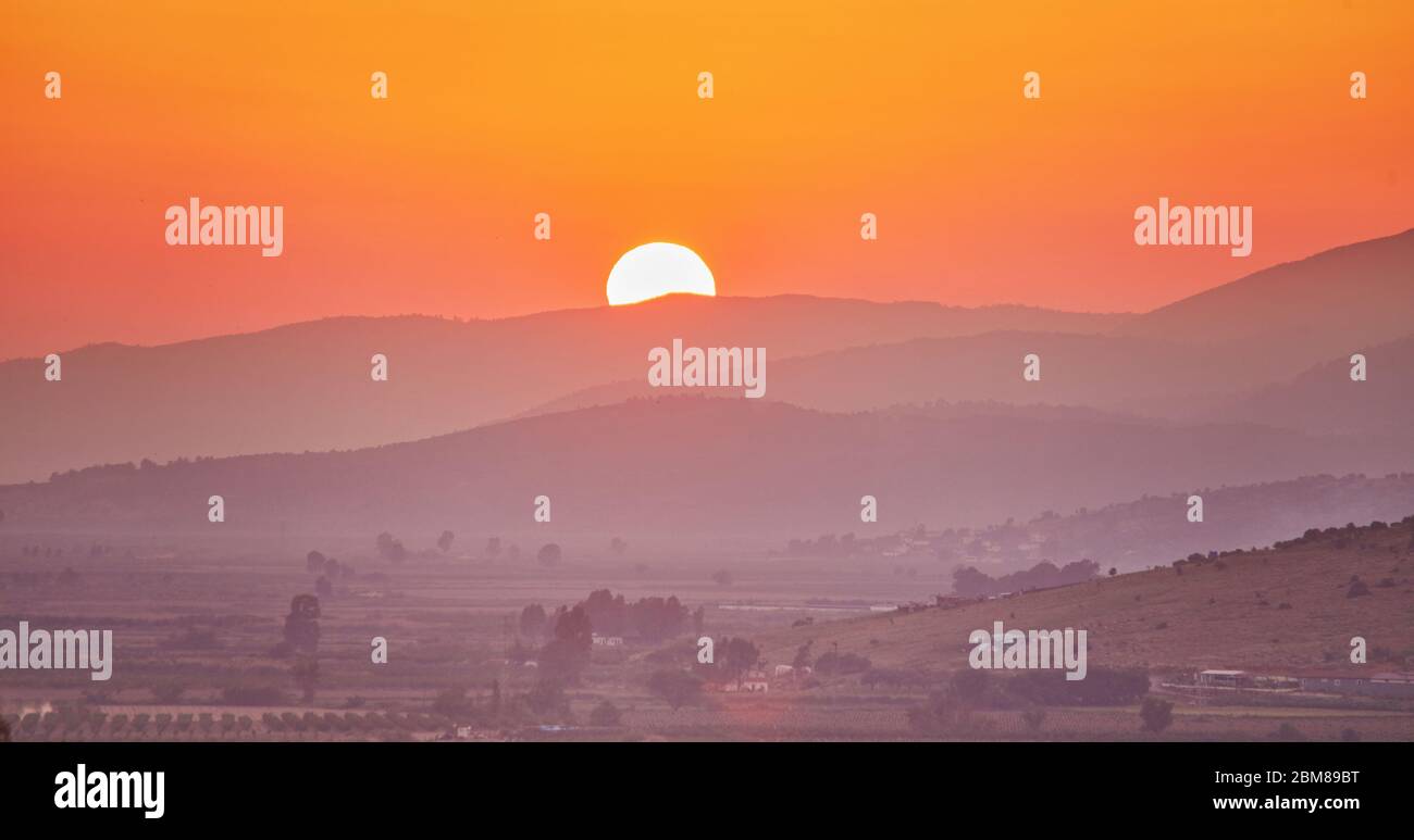 Panorama of beautiful mountains covered with trees at dawn in summer ...