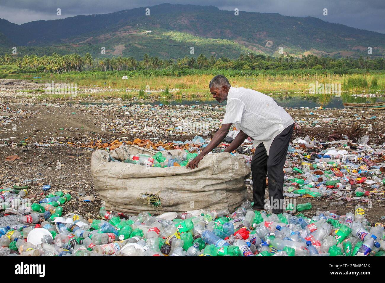 Rigaud St. Claire, 54, sells plastic bottles in the southern Haitian ...