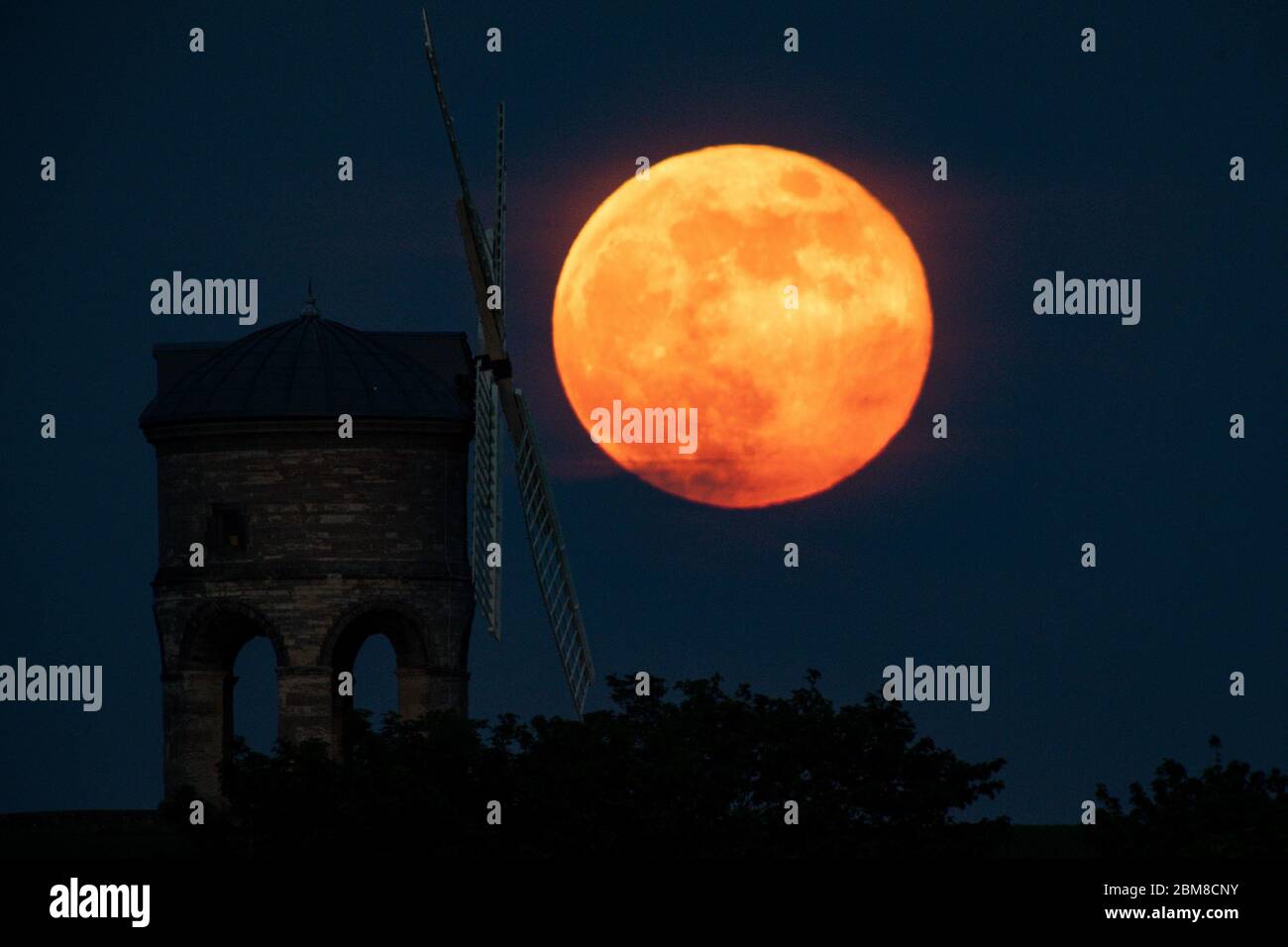 The full moon, also known as the Supermoon or Flower Moon, rises over ...
