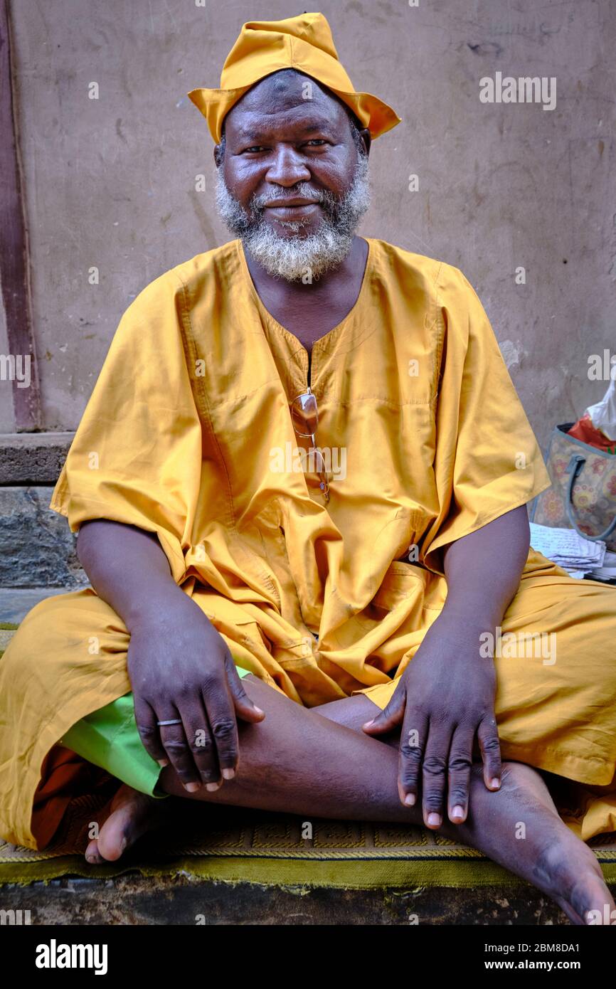 Portrait of a Muslim ascetic dressed in yellow Stock Photo - Alamy