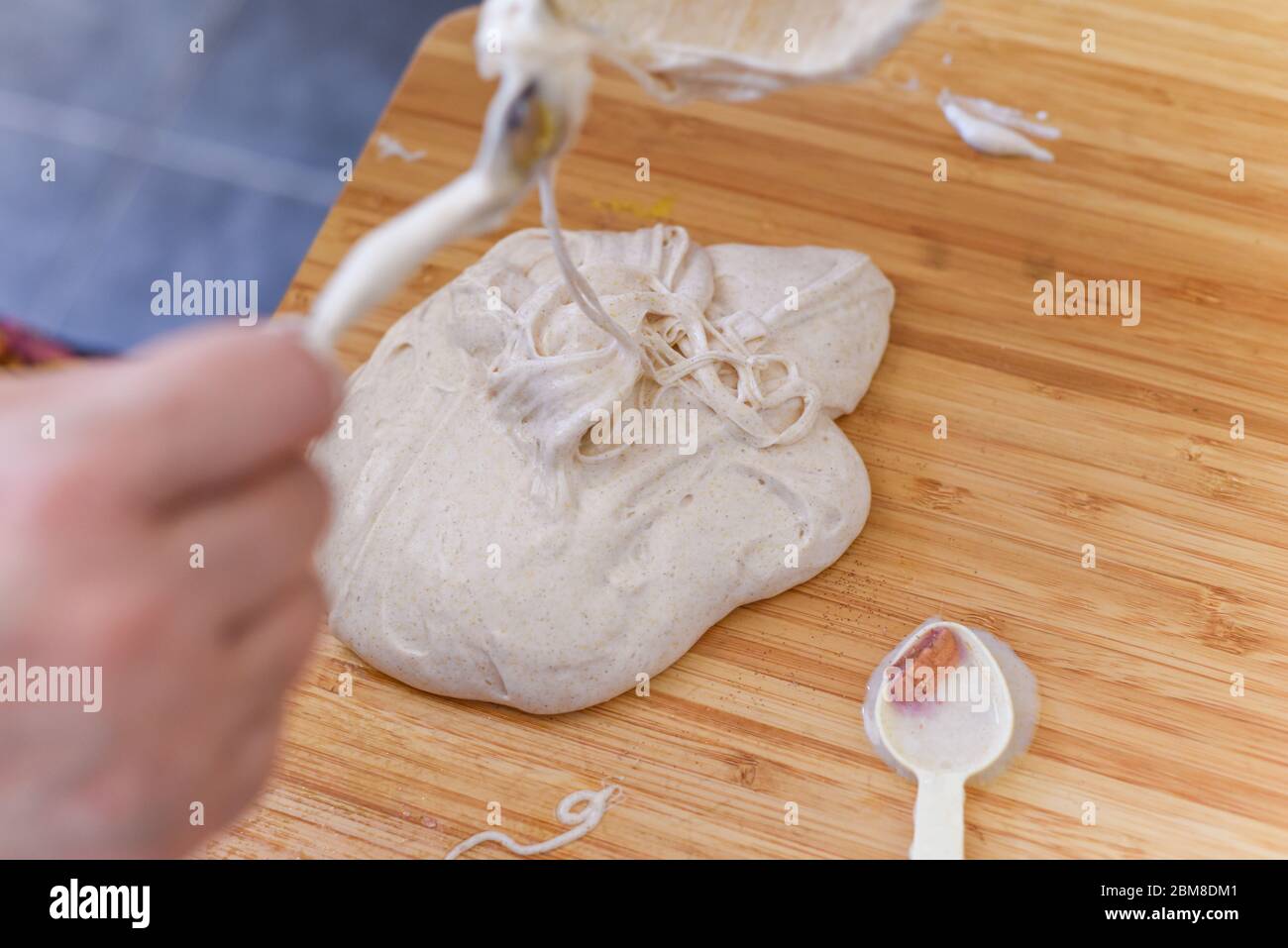 Kids have fun learning at home making slime in a creative science ...