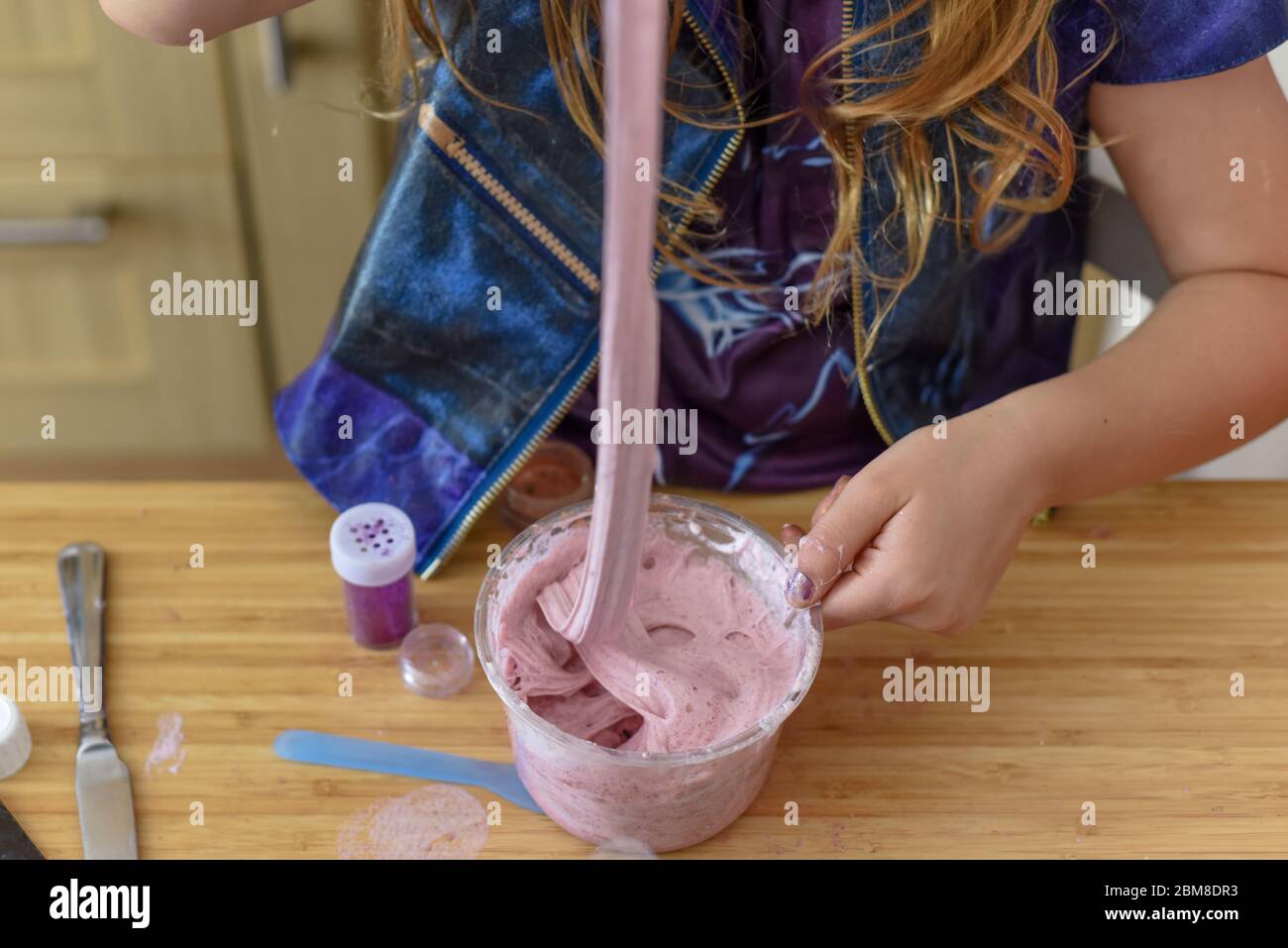 Kids have fun learning at home making slime in a creative science ...