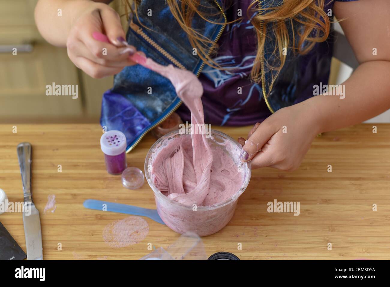 Kids have fun learning at home making slime in a creative science ...