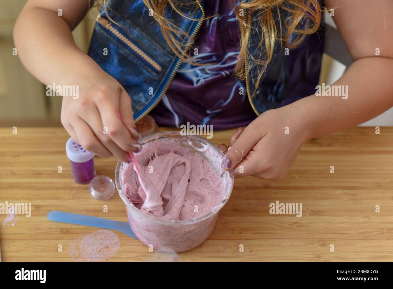 Kids have fun learning at home making slime in a creative science ...