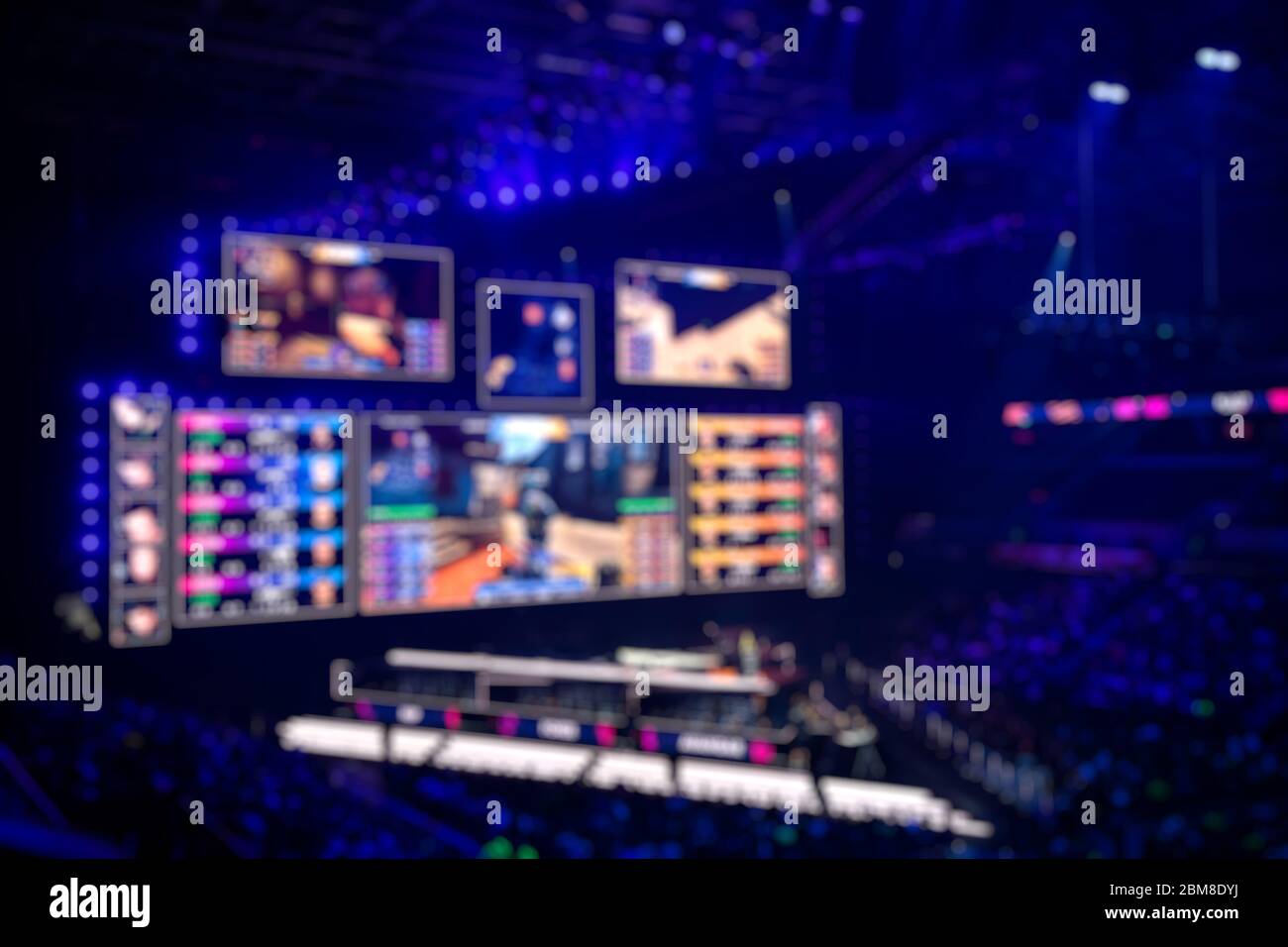 Blurred background of an esports event - Big illuminated main stage of ...