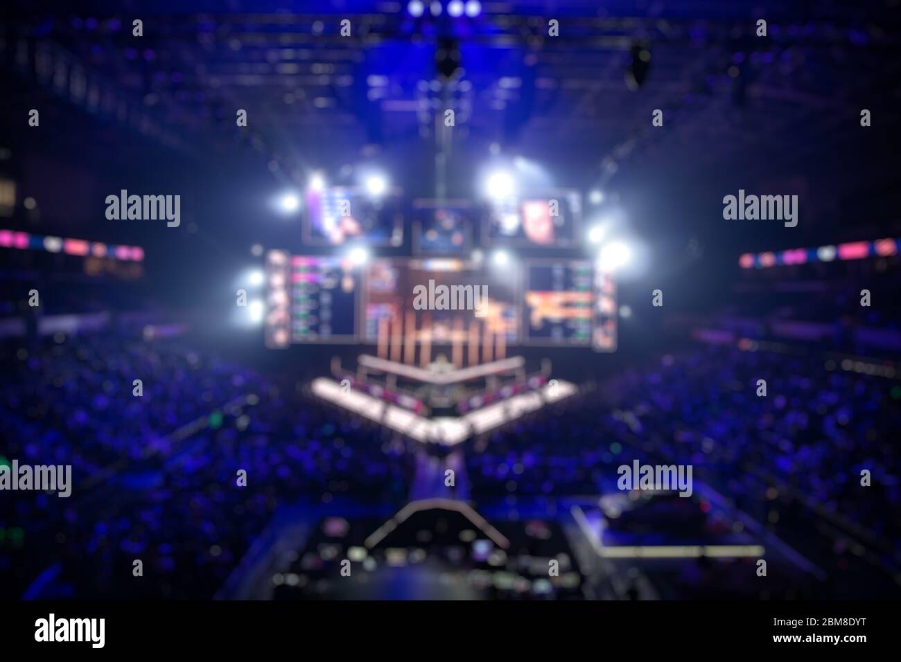 Blurred background of an esports event - Big illuminated main stage of ...