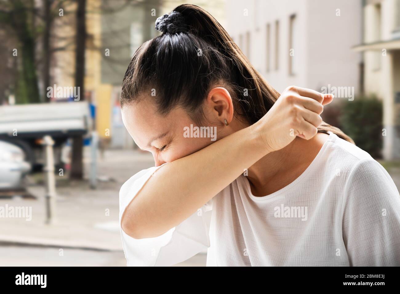 Girl sneezing elbow hi-res stock photography and images - Alamy