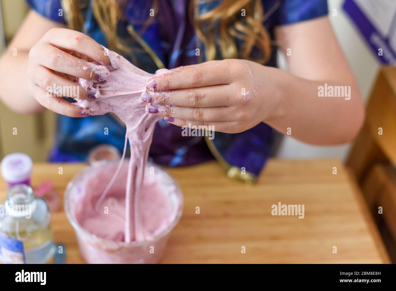 Kids have fun learning at home making slime in a creative science ...
