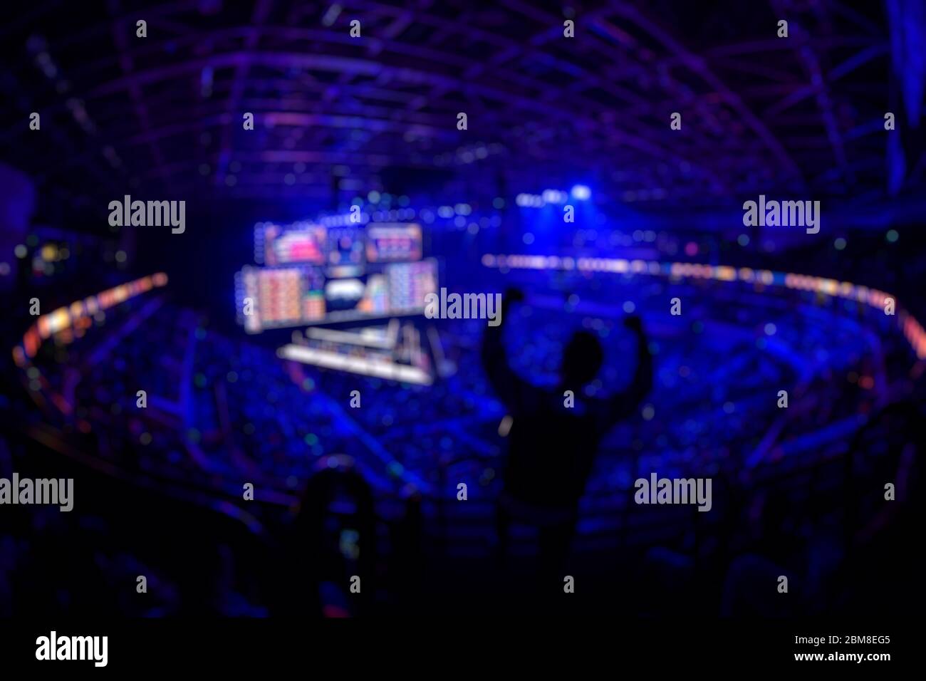 Blurred background of an esports event - Big illuminated main stage of ...