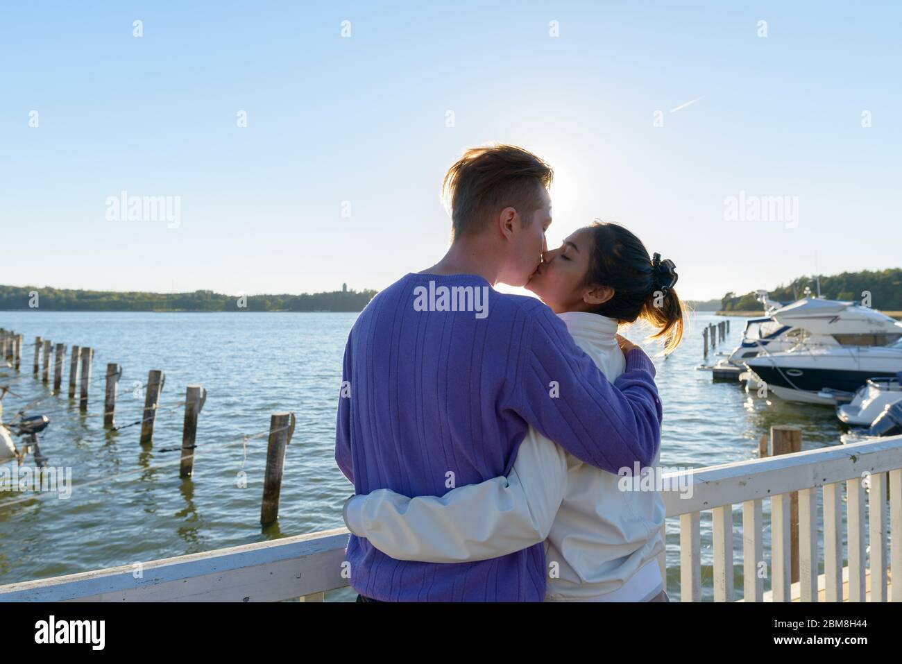 Two young people kissing hi-res stock photography and images - Alamy