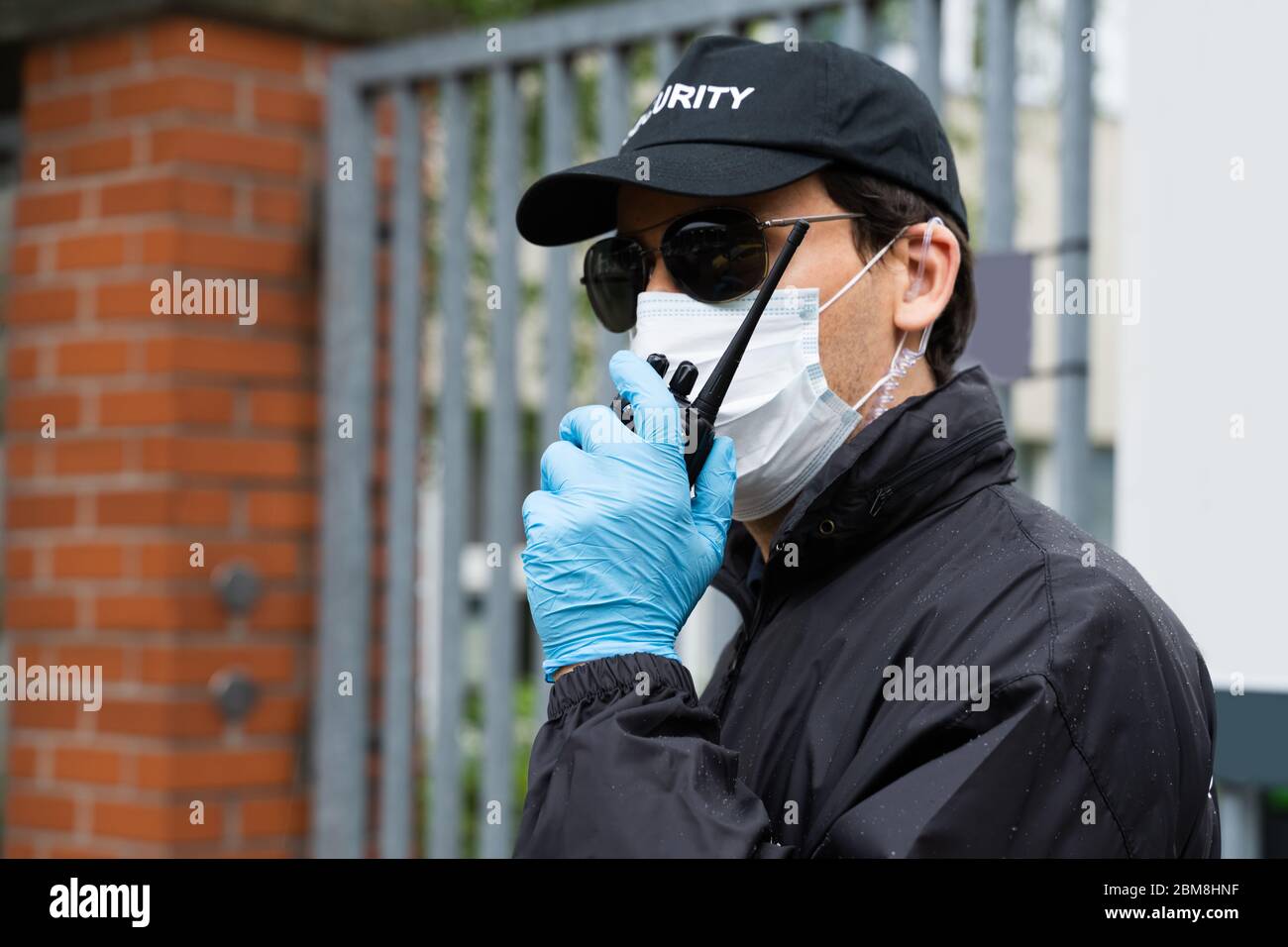 Policeman talking on radio hi-res stock photography and images - Alamy