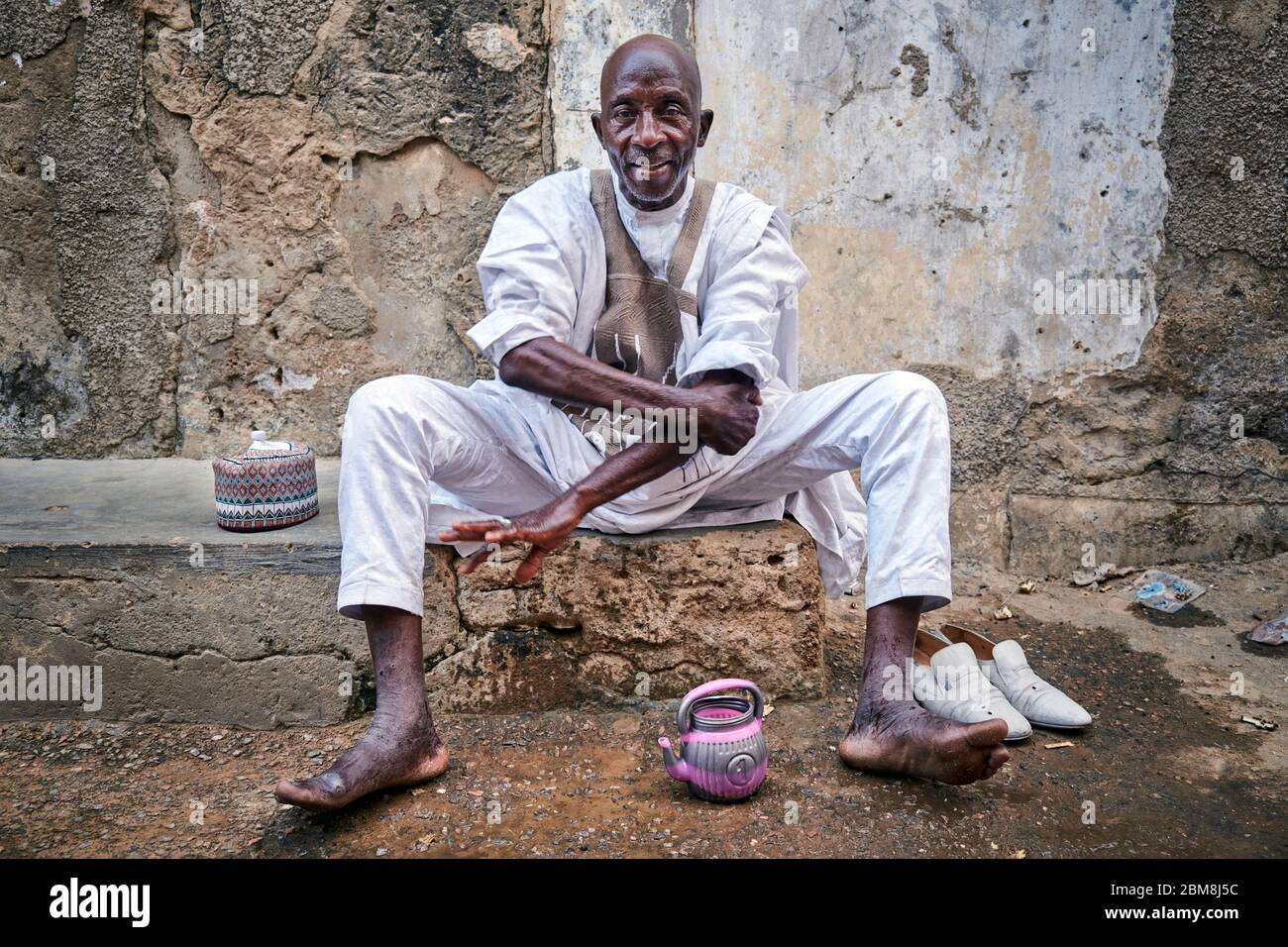 Muslim man doing wudu in preparation for prayers. Wudu is the Islamic ...