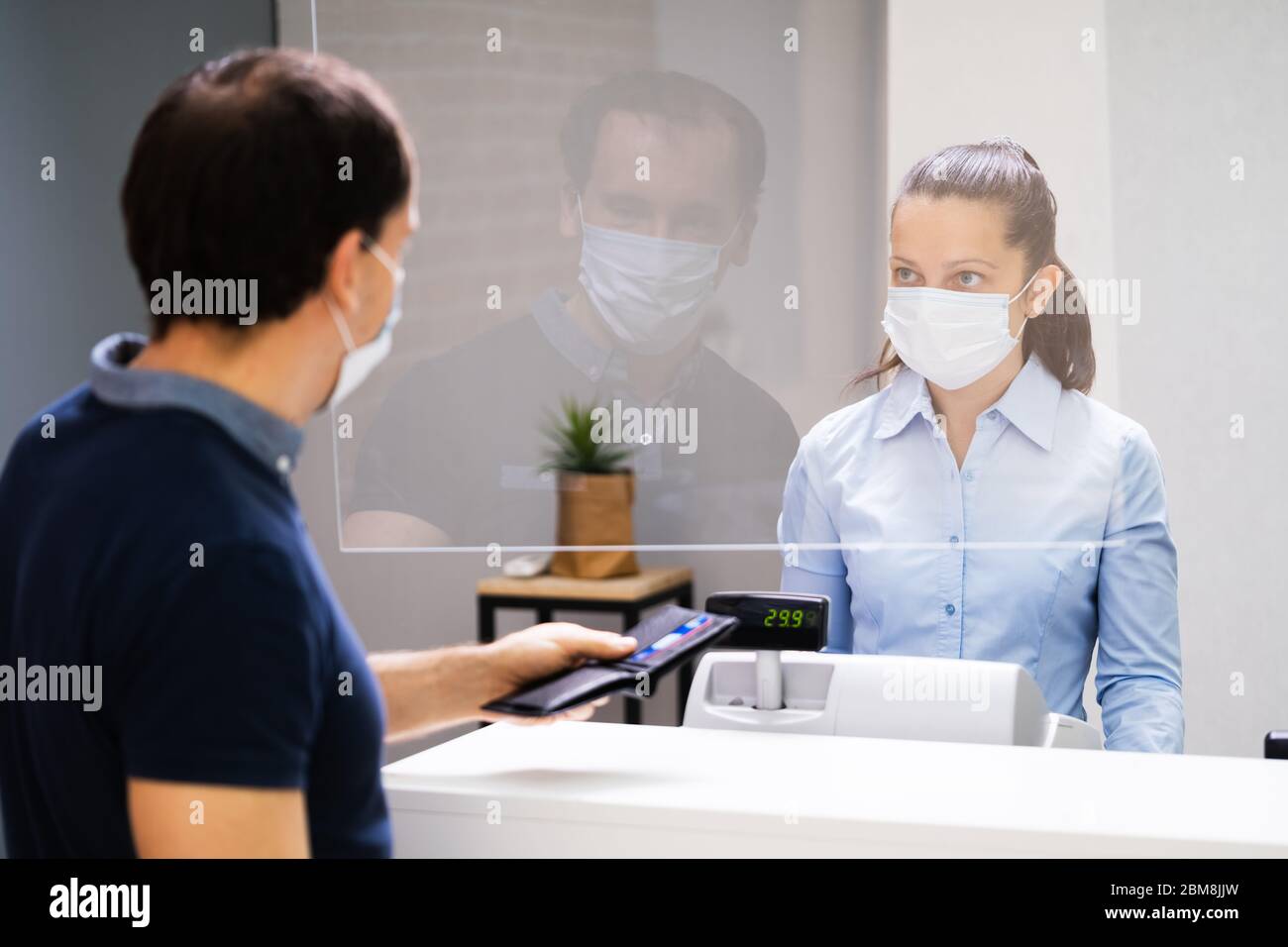 Client Using Contactless Payment In Store Wearing Face Mask Stock Photo ...