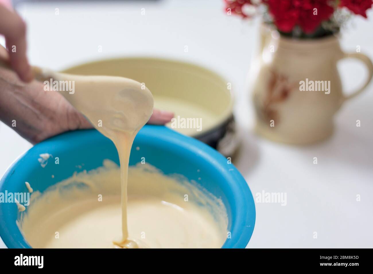 Woman stirring cake mix hi-res stock photography and images - Alamy