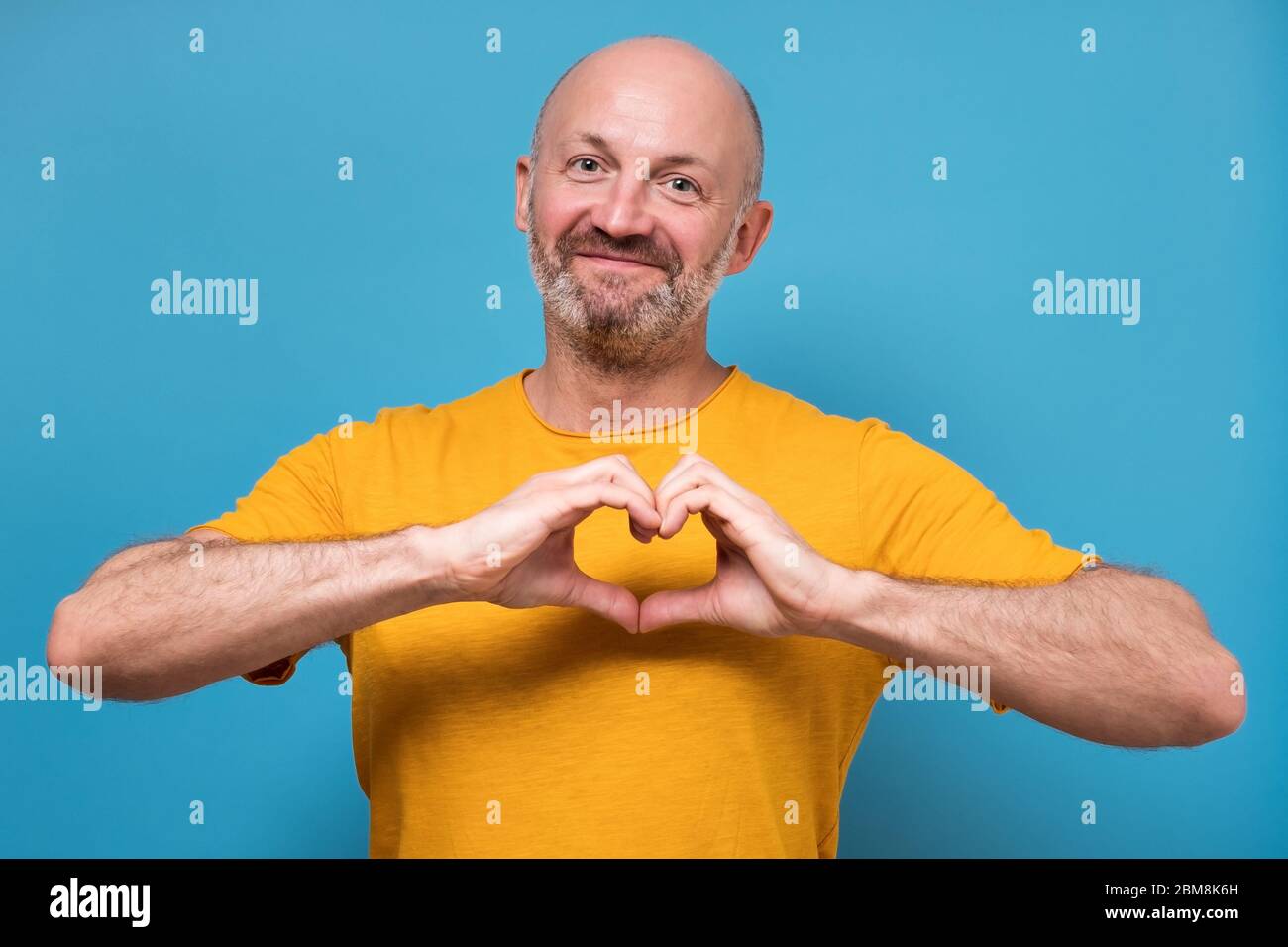 Happy handsome guy posing hi-res stock photography and images - Alamy