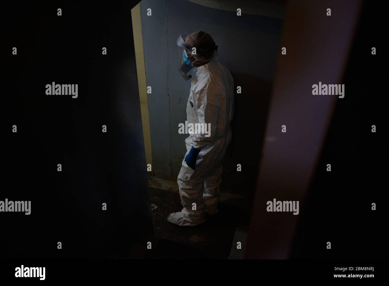 Revere, Massachusetts, U.S.A. 7th May, 2020. Joel, an embalmer, puts on ...