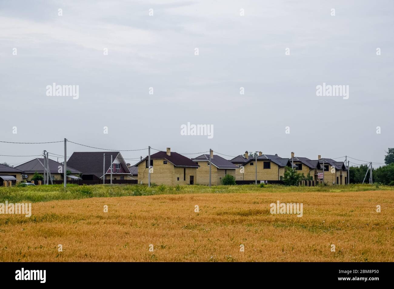 A cottage village of two-storey houses. Low-rise development Stock ...