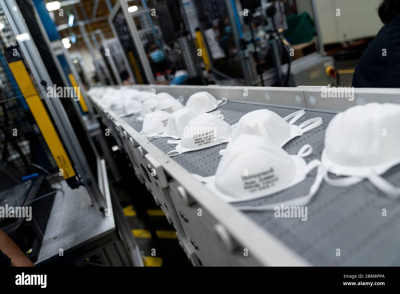 N95 Personal Protection masks travel down the assembly line at ...