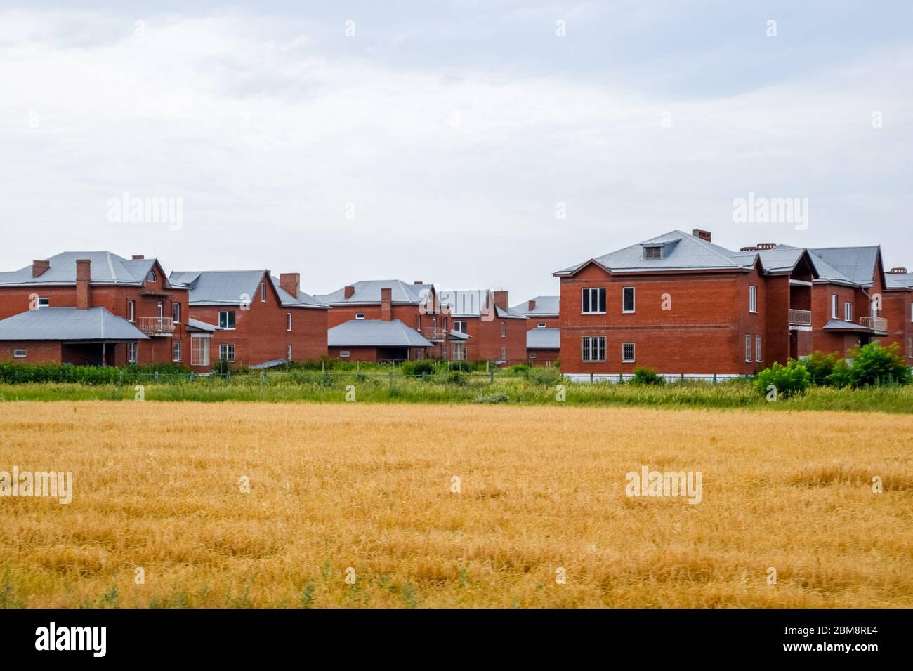 A cottage village of two-storey houses. Low-rise development Stock ...