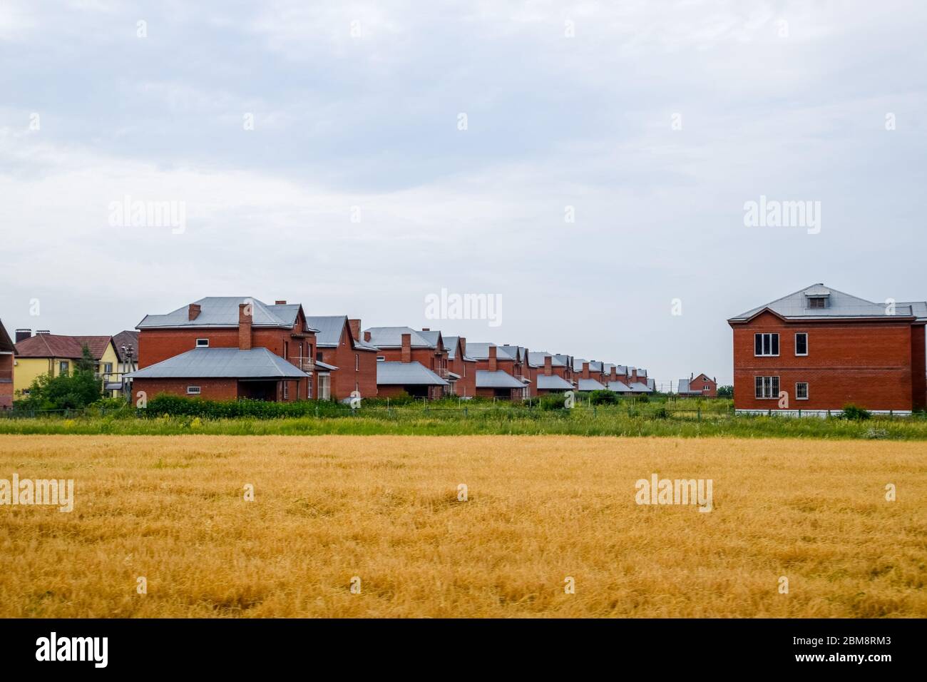 A cottage village of two-storey houses. Low-rise development Stock ...