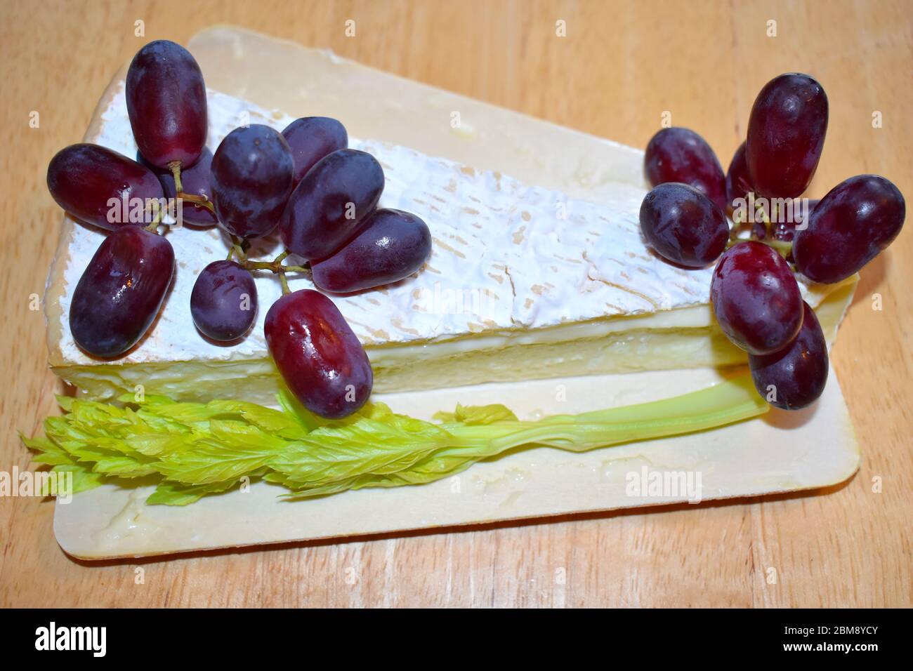 Soft brie cheese made from cow milk. It has white mould ring considered ...