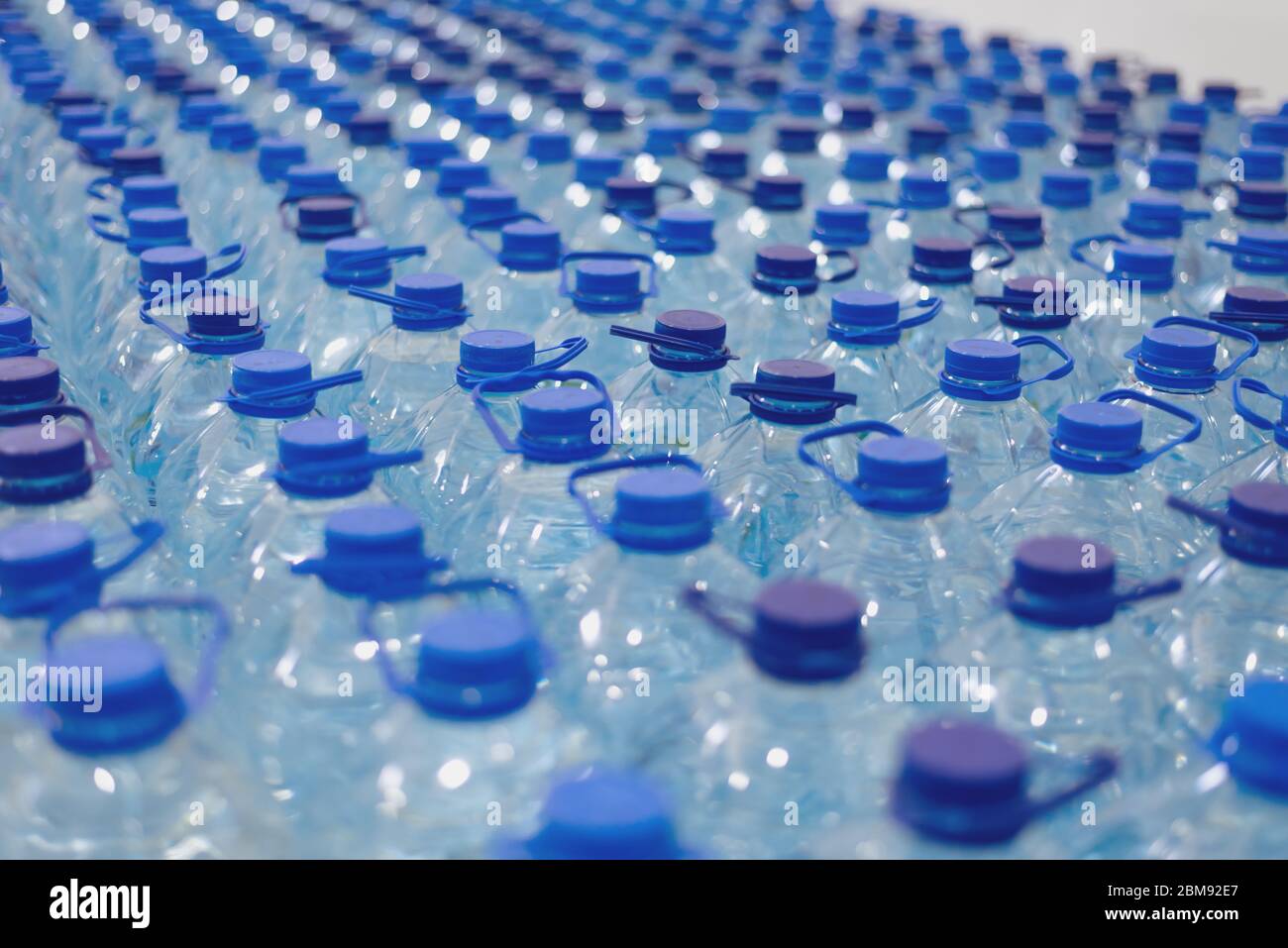 Lot of bottles worth with clean cool natural water. Group of plastic ...