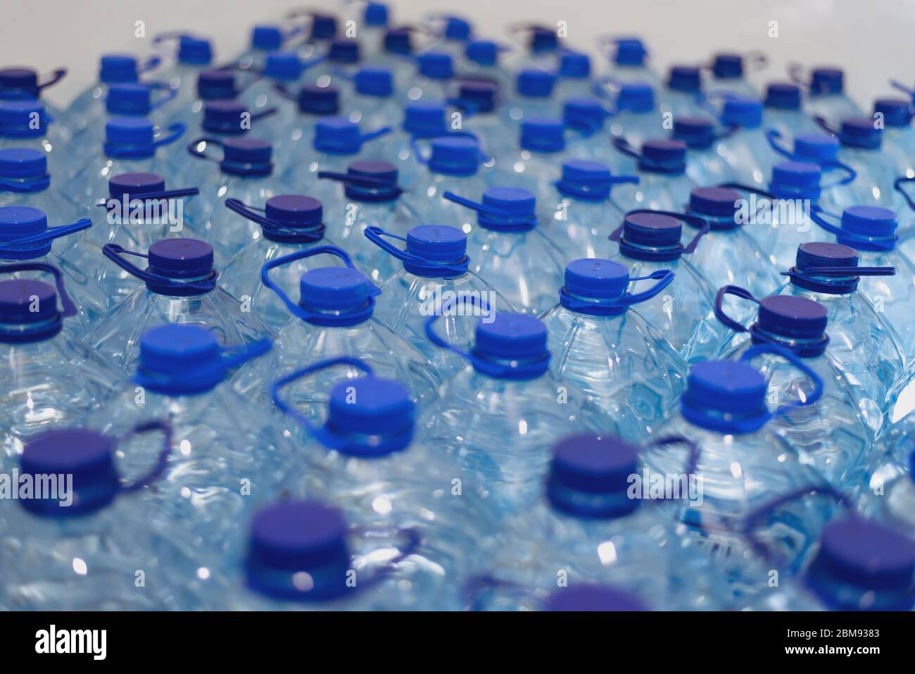 Lot of bottles worth with clean cool natural water. Group of plastic ...